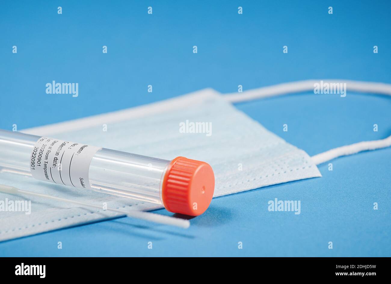 transparent vial transport tube with orange closure and adhesive for ...