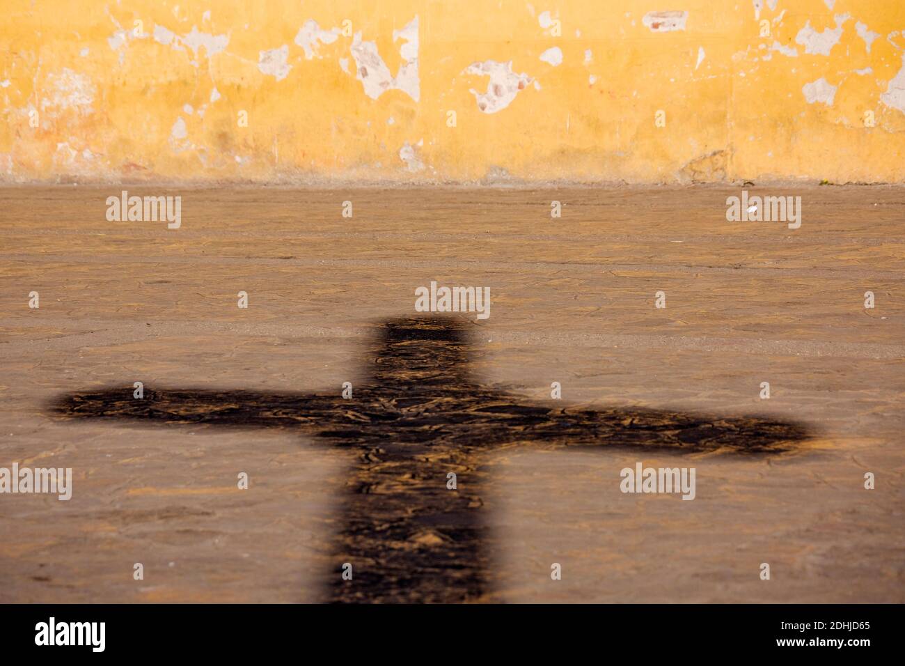 Shadow of a crucifix on a street pavement Stock Photo - Alamy