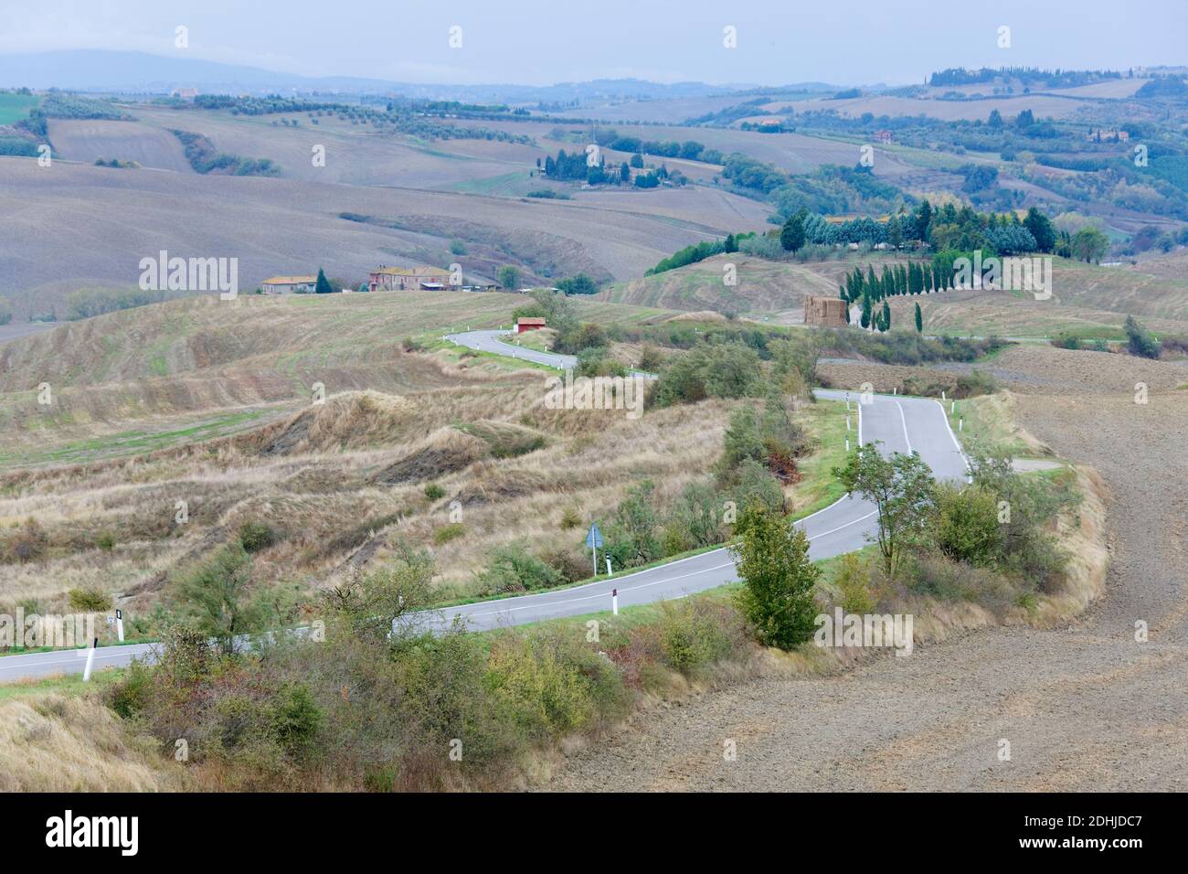 Road in rural hilly landscape Stock Photo - Alamy