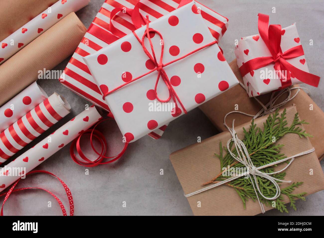 Red and white gift box with ribbon and wrapping paper. Overhead view of ...