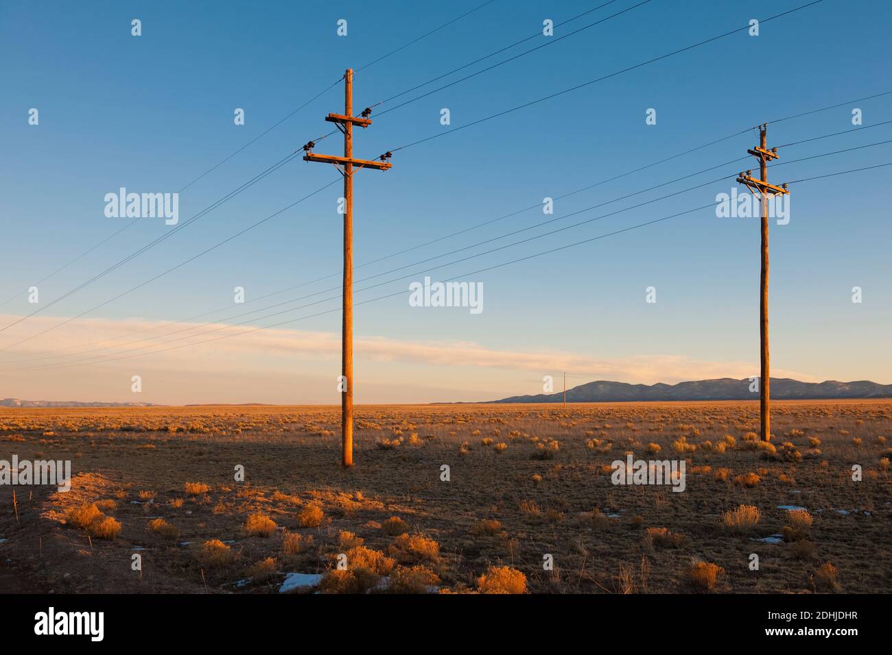 Power lines in desert landscape Stock Photo - Alamy