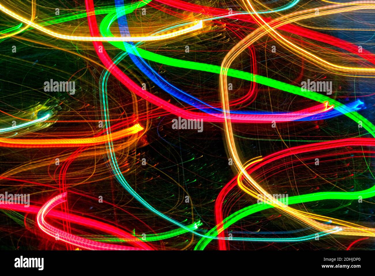 Abstract light trails on dark background Stock Photo - Alamy