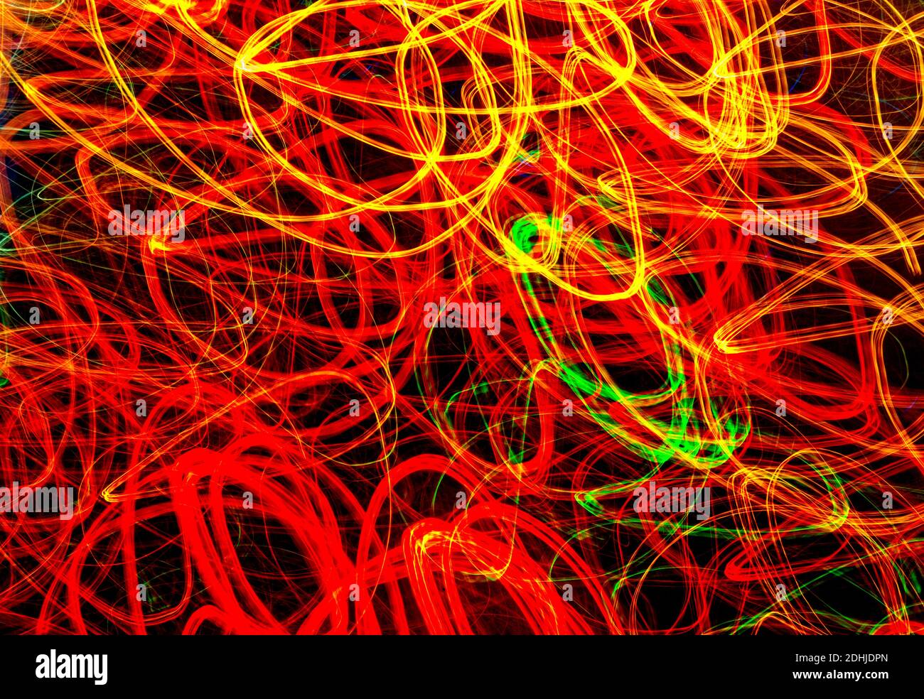 Abstract light trails on dark background Stock Photo - Alamy