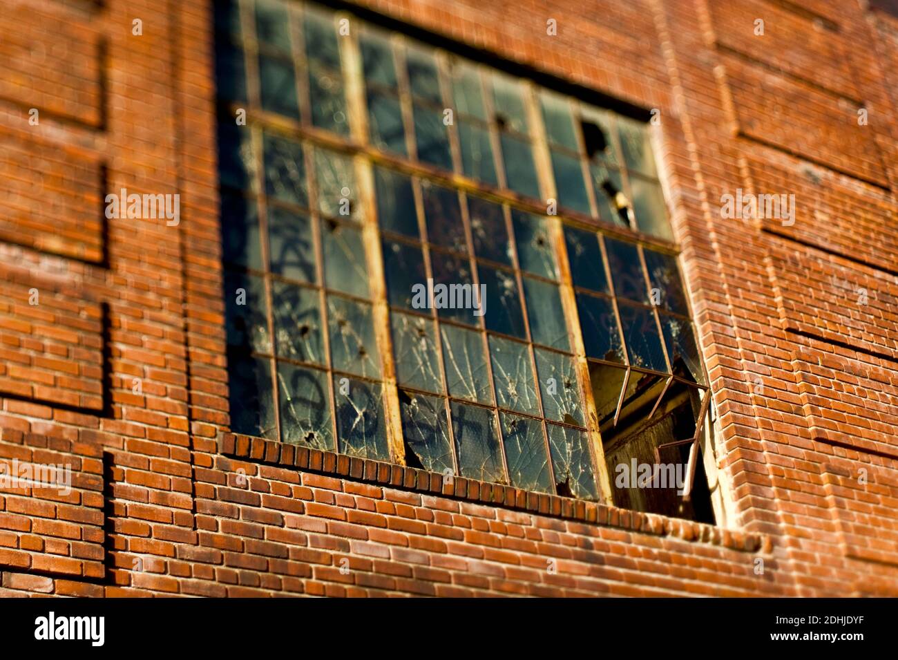 Broken window in old warehouse Stock Photo - Alamy
