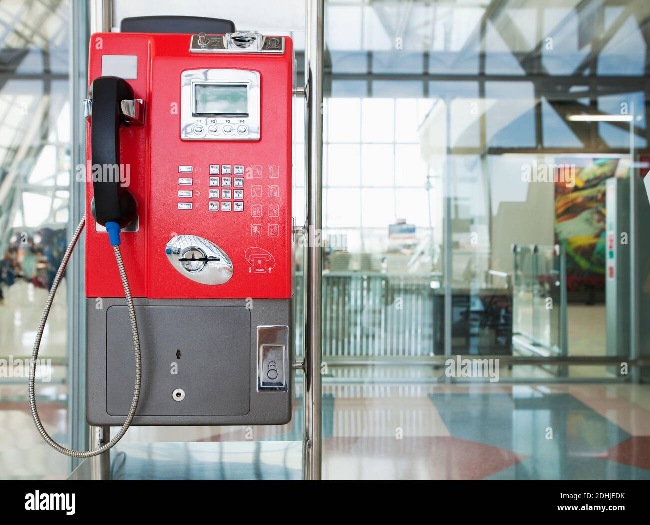 Public telephone in transport building Stock Photo - Alamy