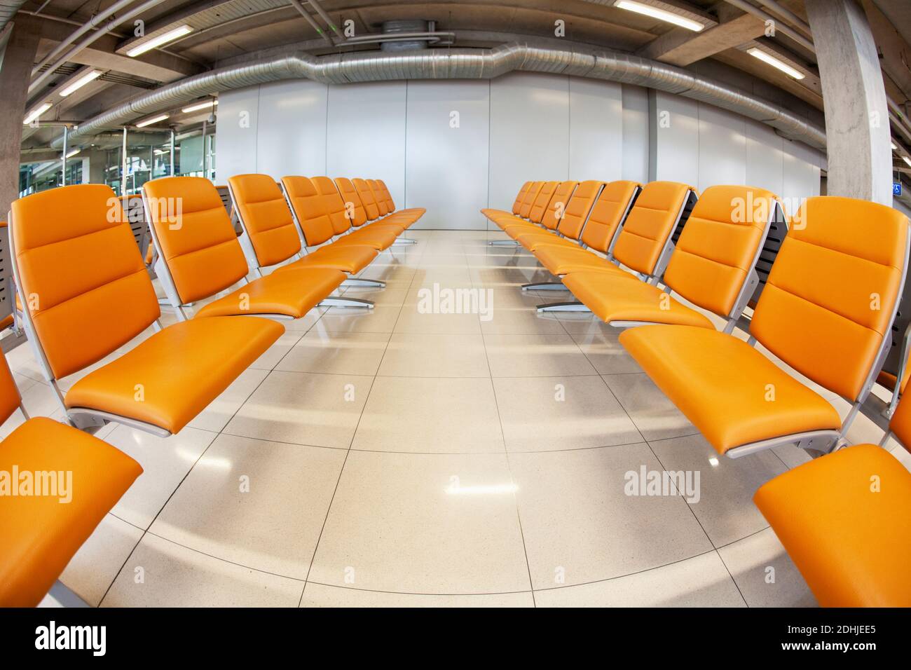 Seats in waiting area at airport Stock Photo - Alamy