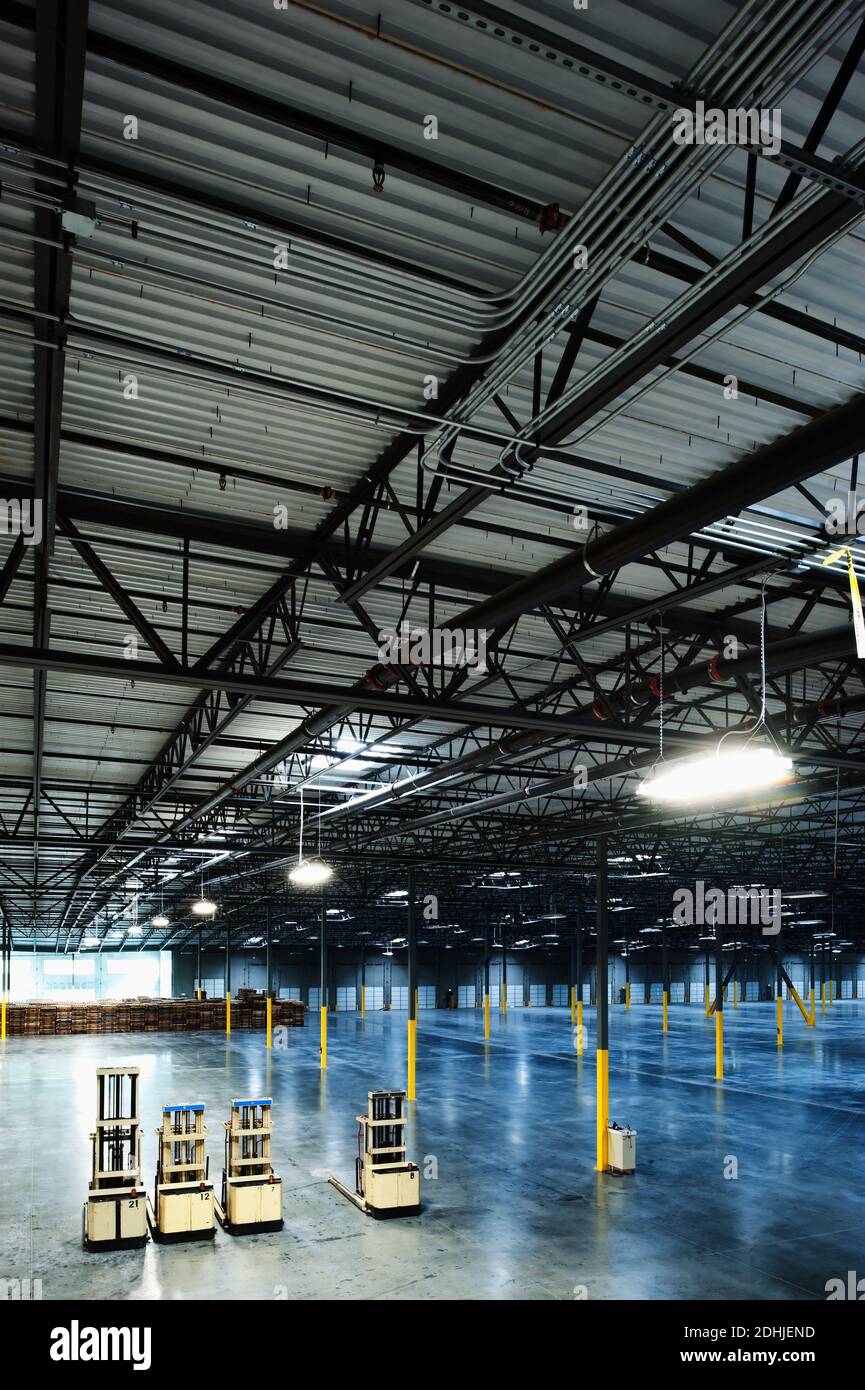 Forklifts in warehouse Stock Photo - Alamy