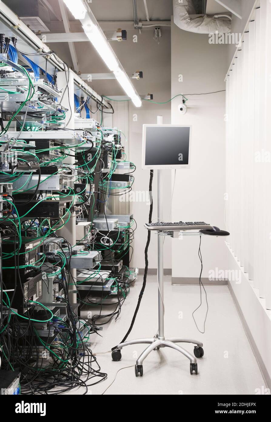 Tangled computer server cords in server room Stock Photo - Alamy