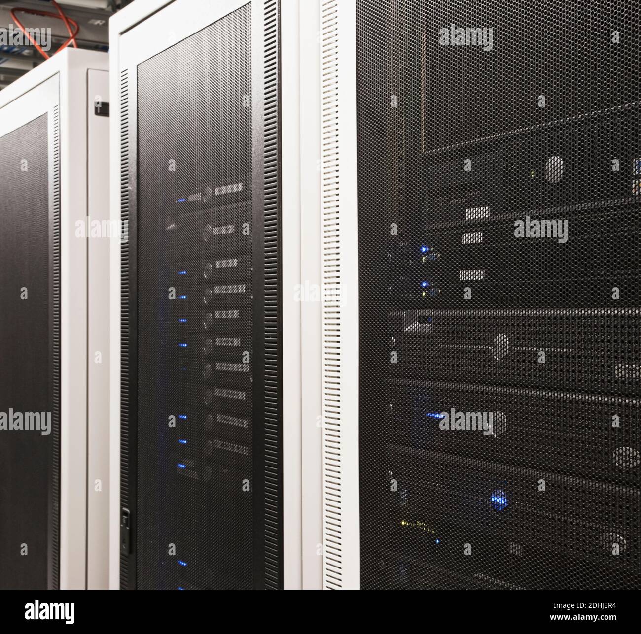 Computer servers in cabinets Stock Photo - Alamy