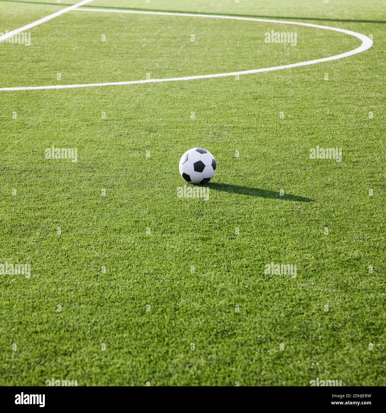 Soccer ball on soccer field Stock Photo - Alamy