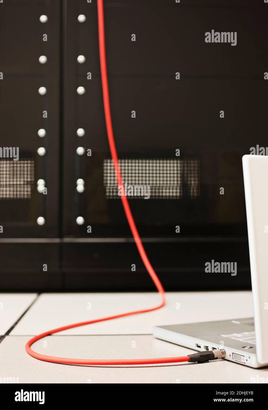 Cable plugged into laptop Stock Photo - Alamy