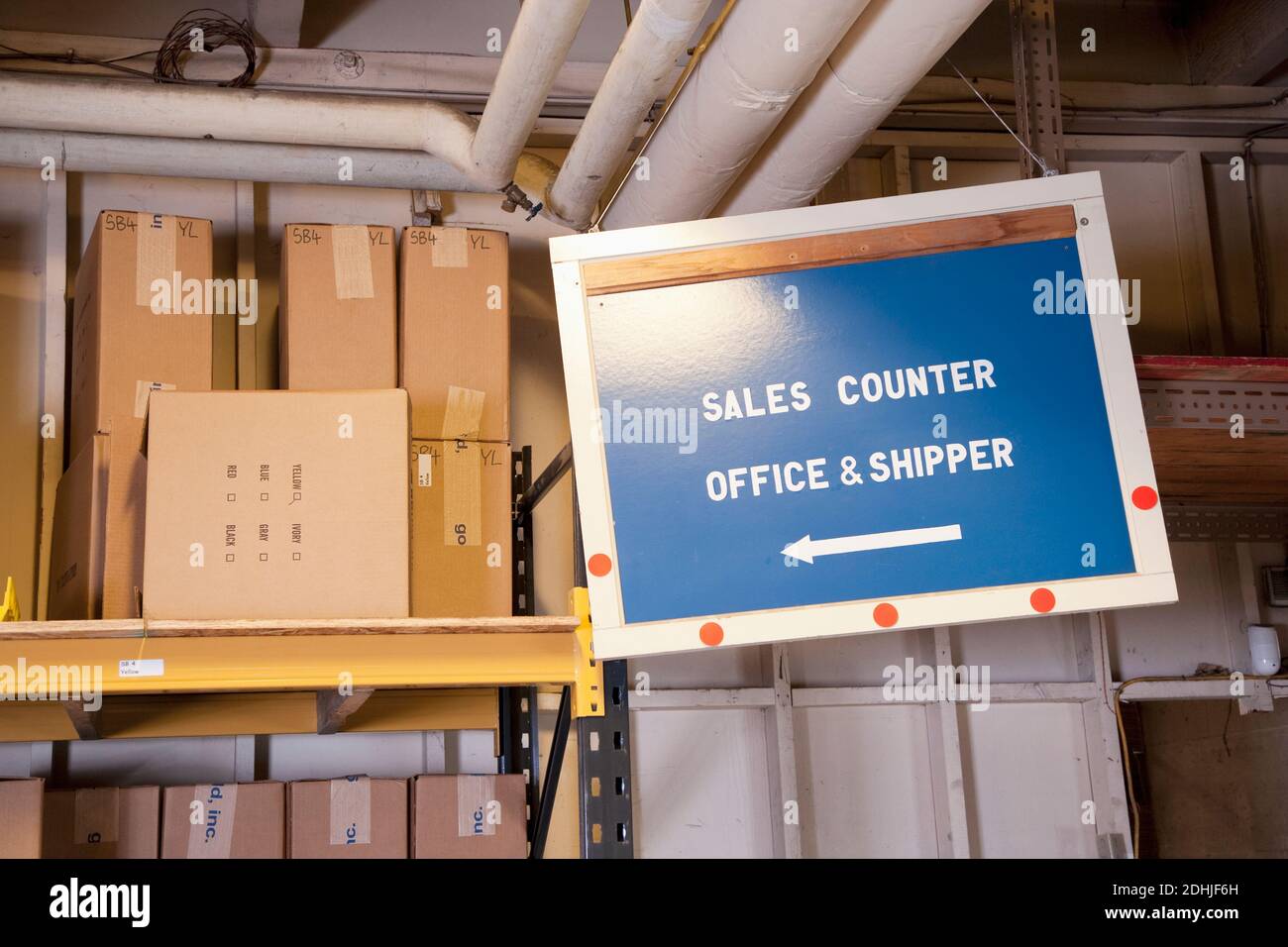 Sales counter sign and cardboard boxes on shelf in warehouse Stock ...