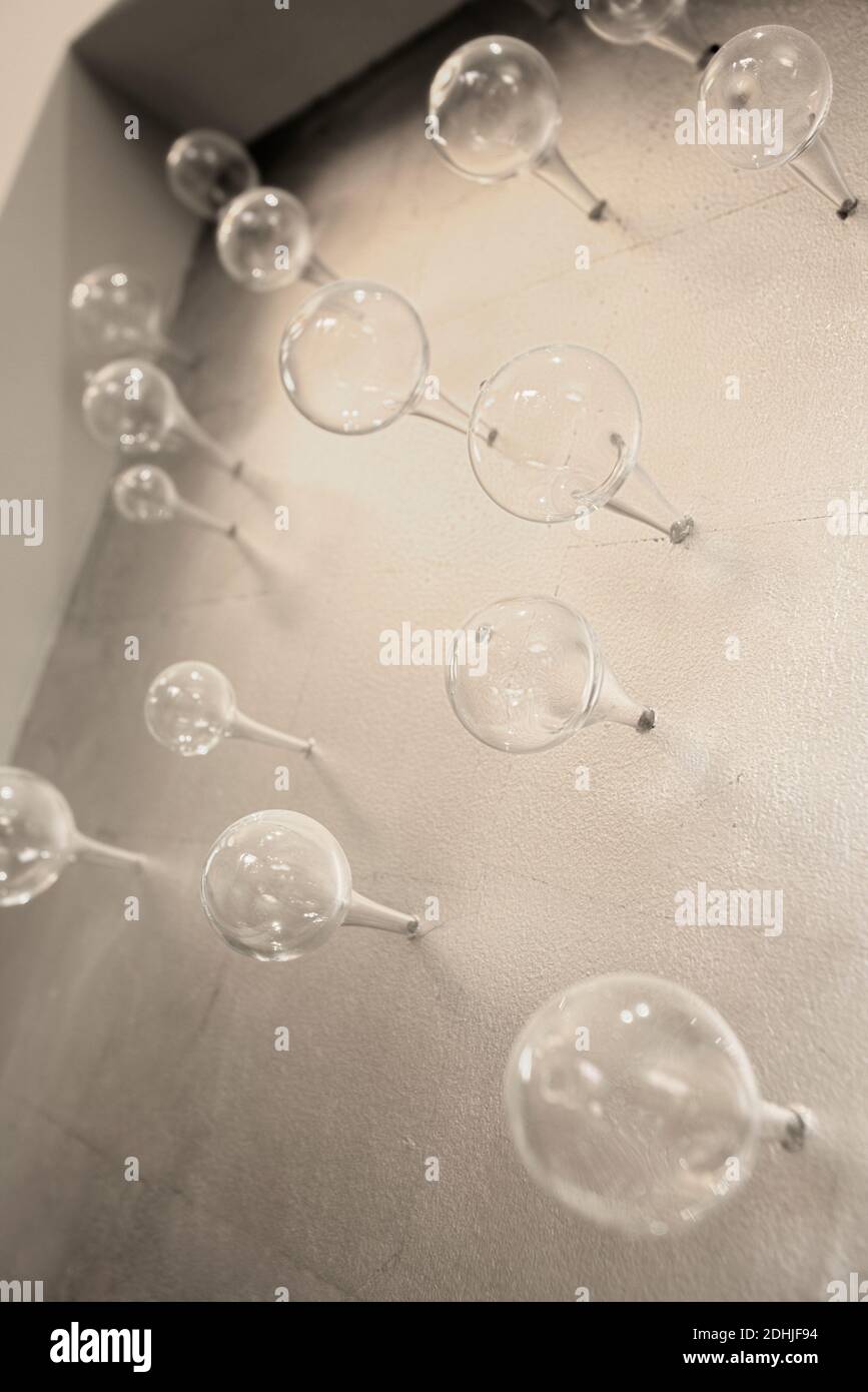 Glass spheres on concrete wall Stock Photo - Alamy