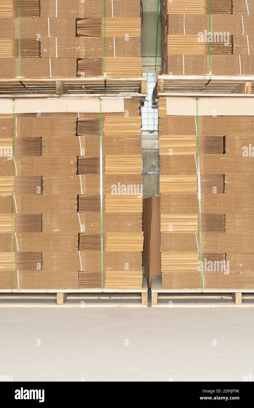 Pallets of flat folded cardboard boxes Stock Photo - Alamy