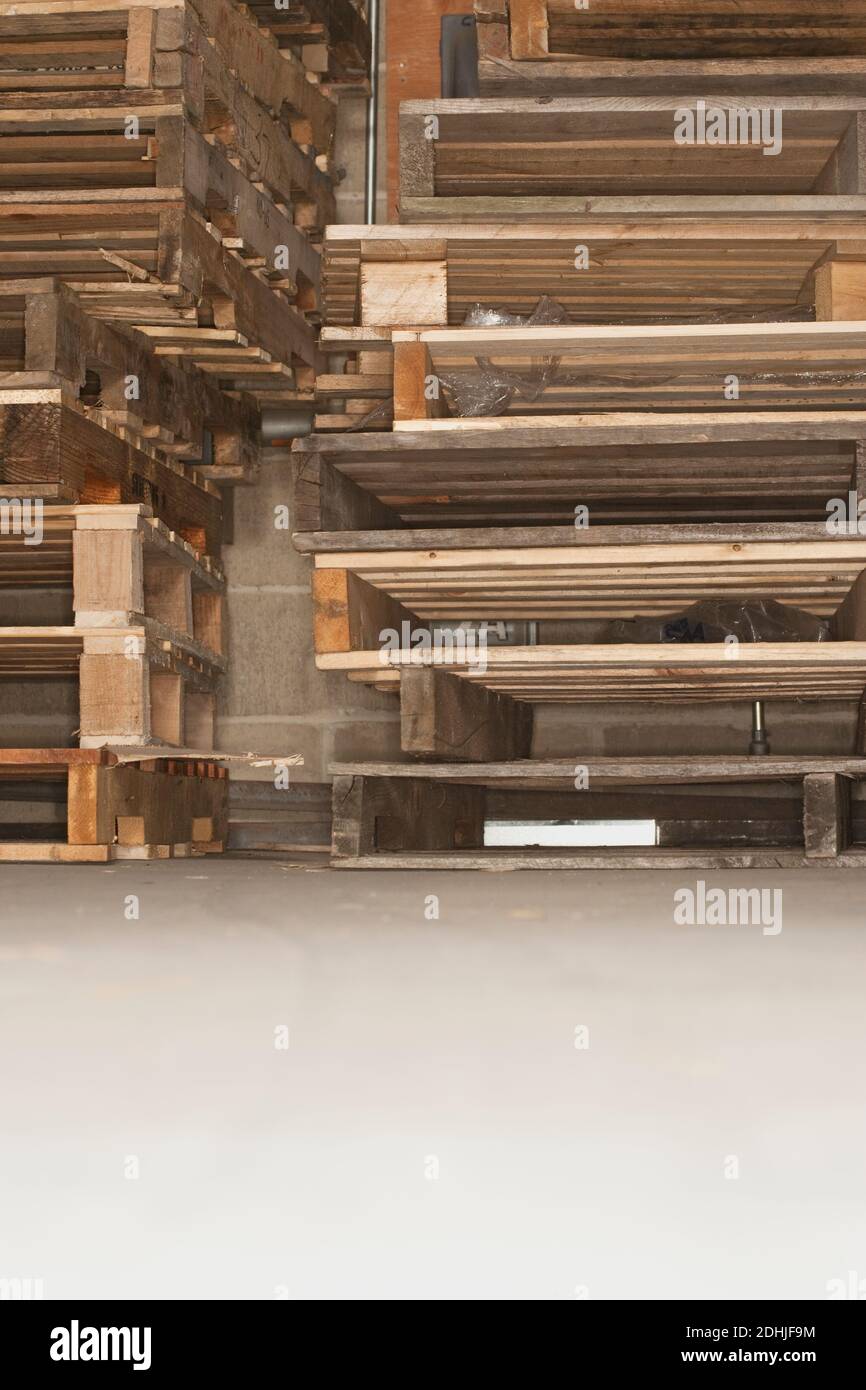 Wooden pallets piled up Stock Photo - Alamy
