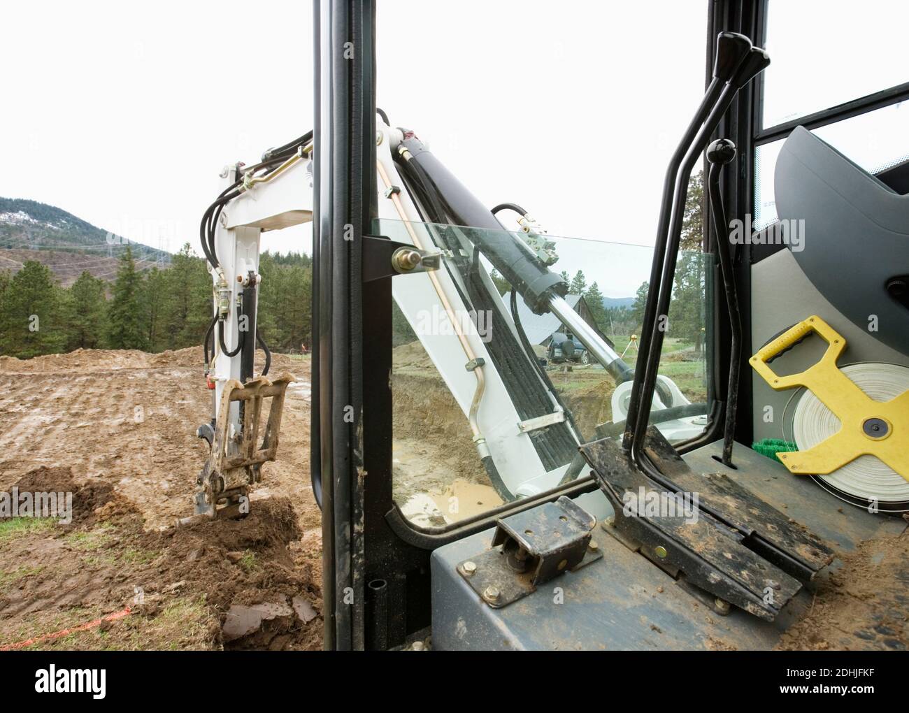 Mechanical digger excavating ground in rural environment Stock Photo ...
