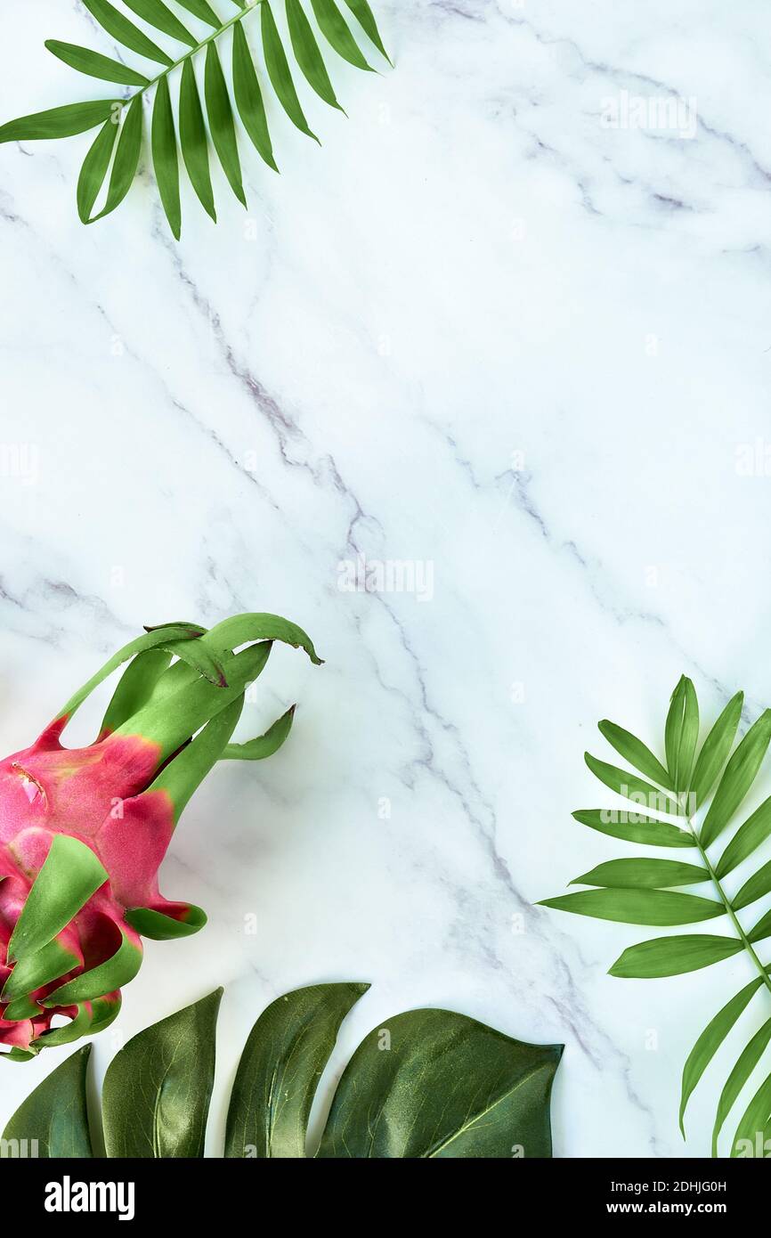 Fresh organic pink dragon fruit, pitaya or pitahaya, on marble table ...