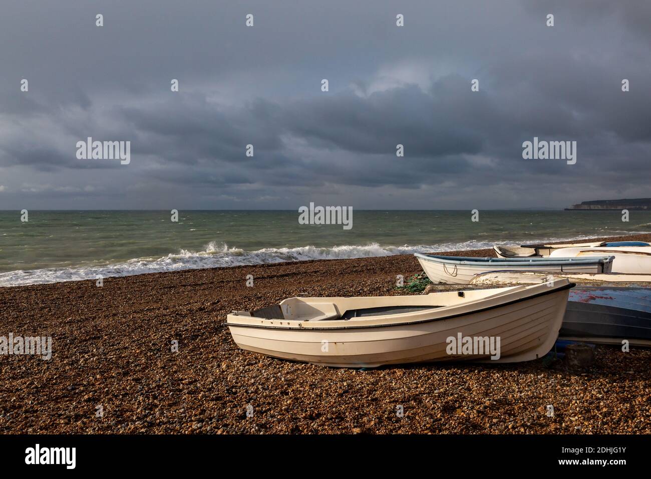 Boats on the pebble beach at Seaford in Sussex Stock Photo - Alamy