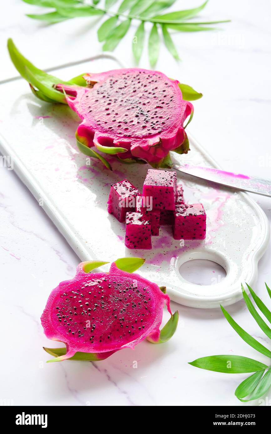 Pink dragon fruit, pitaya or pitahaya sliced in cubes. Trendy superfood ...