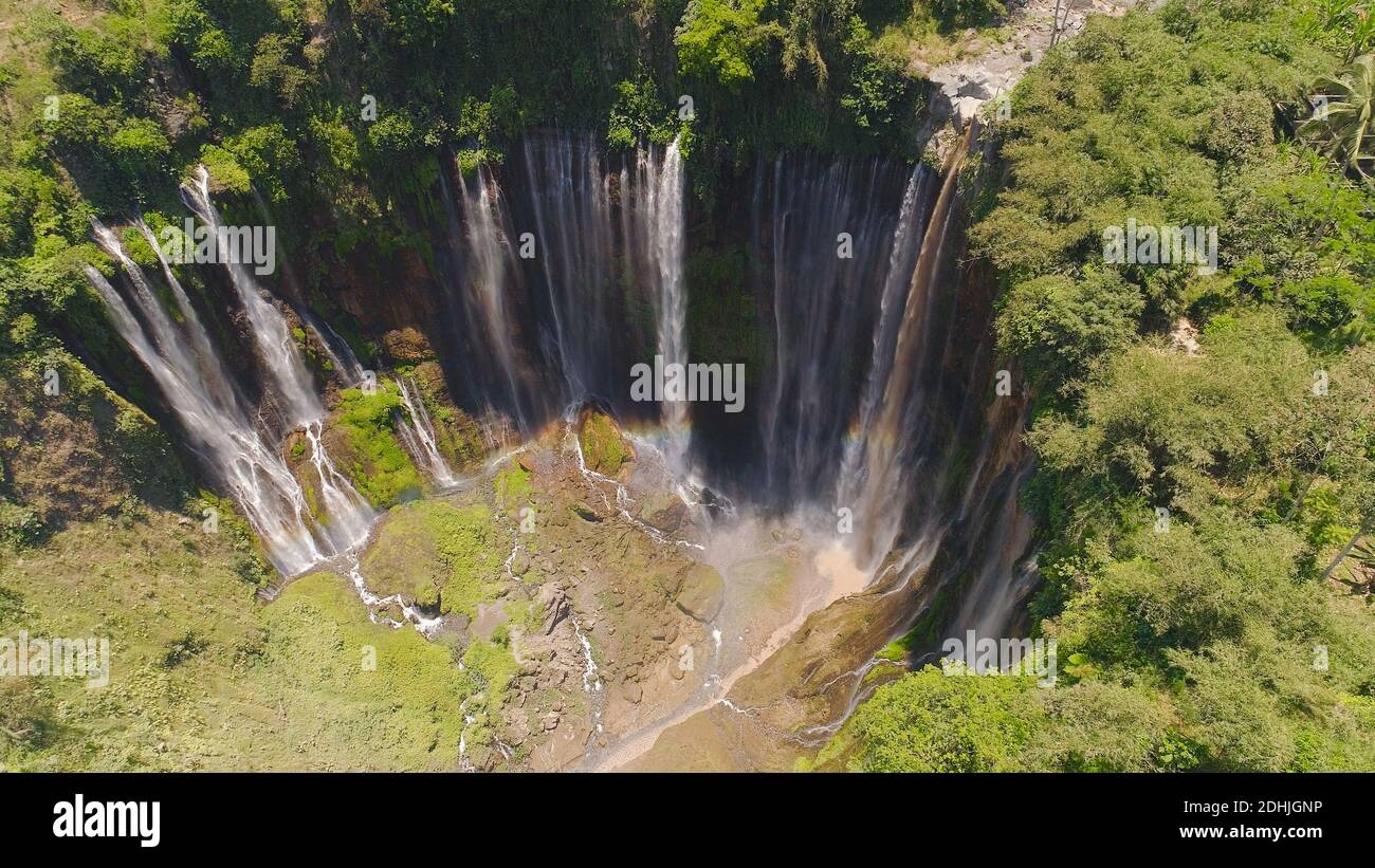 beautiful waterfall Coban Sewu in tropical forest, Java Indonesia ...