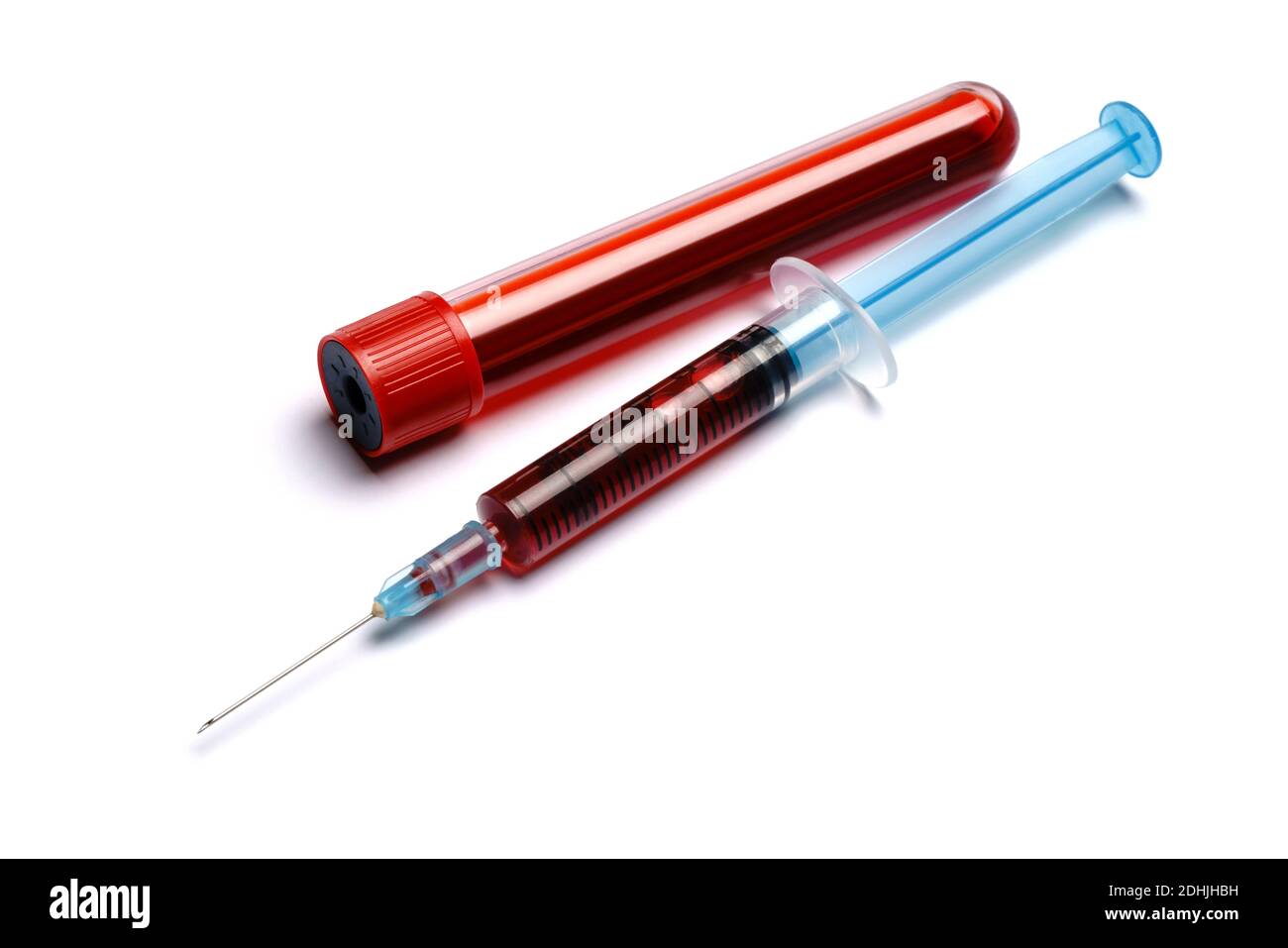 Medical syringe and plastic test tube isolated on white background ...