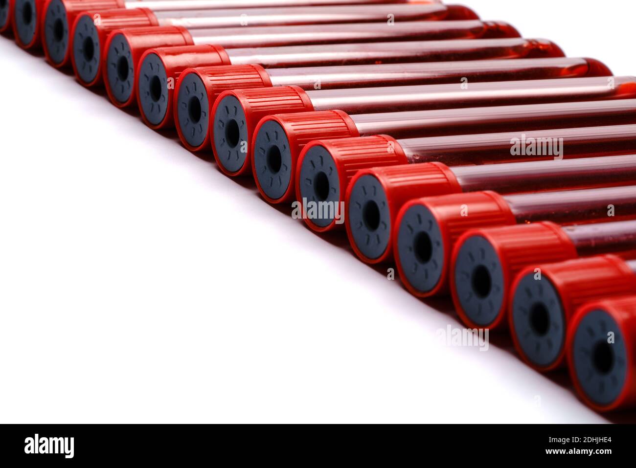 Test tubes with red plug isolated on white background Stock Photo - Alamy