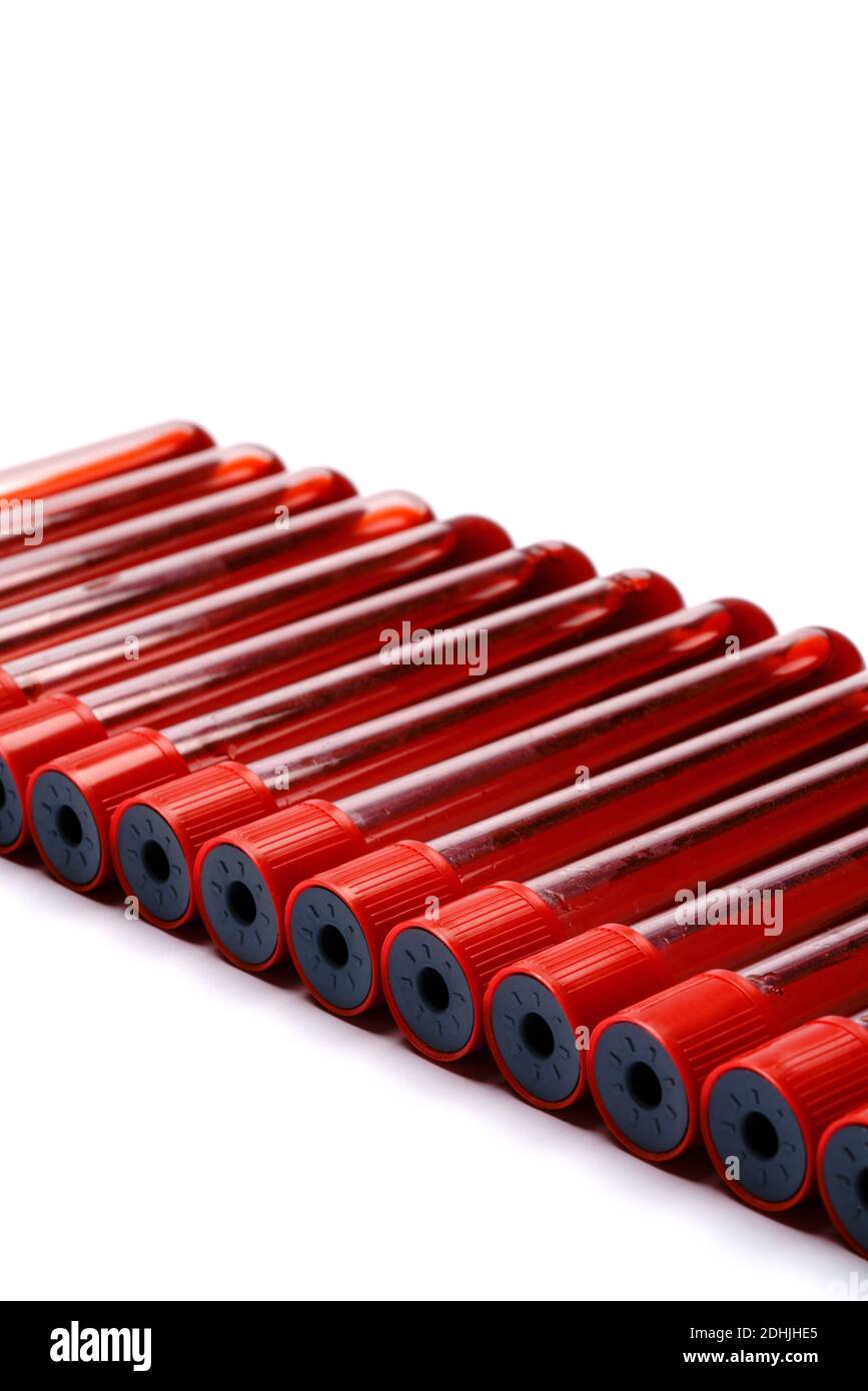 Test tubes with red plug isolated on white background Stock Photo - Alamy