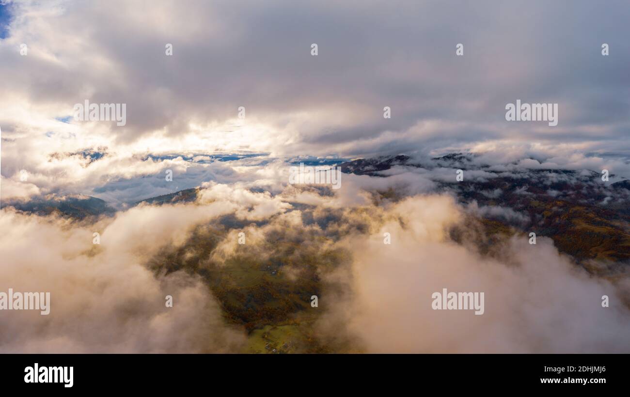 Autumn flight through blue sky in Carpatian autumn mountains, Aerial ...