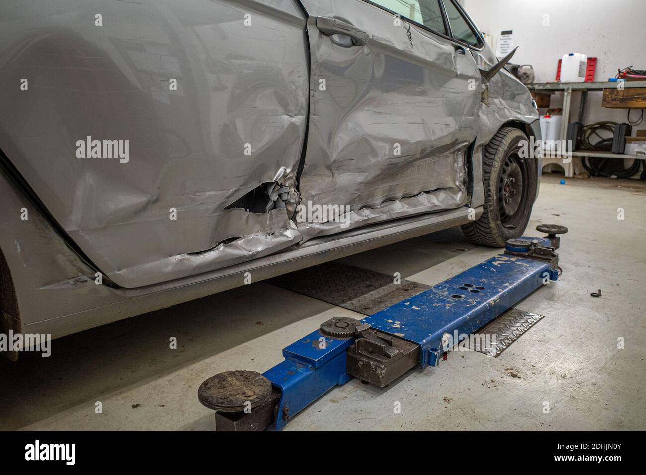 a demolished car stands in a garage after an accident Stock Photo - Alamy