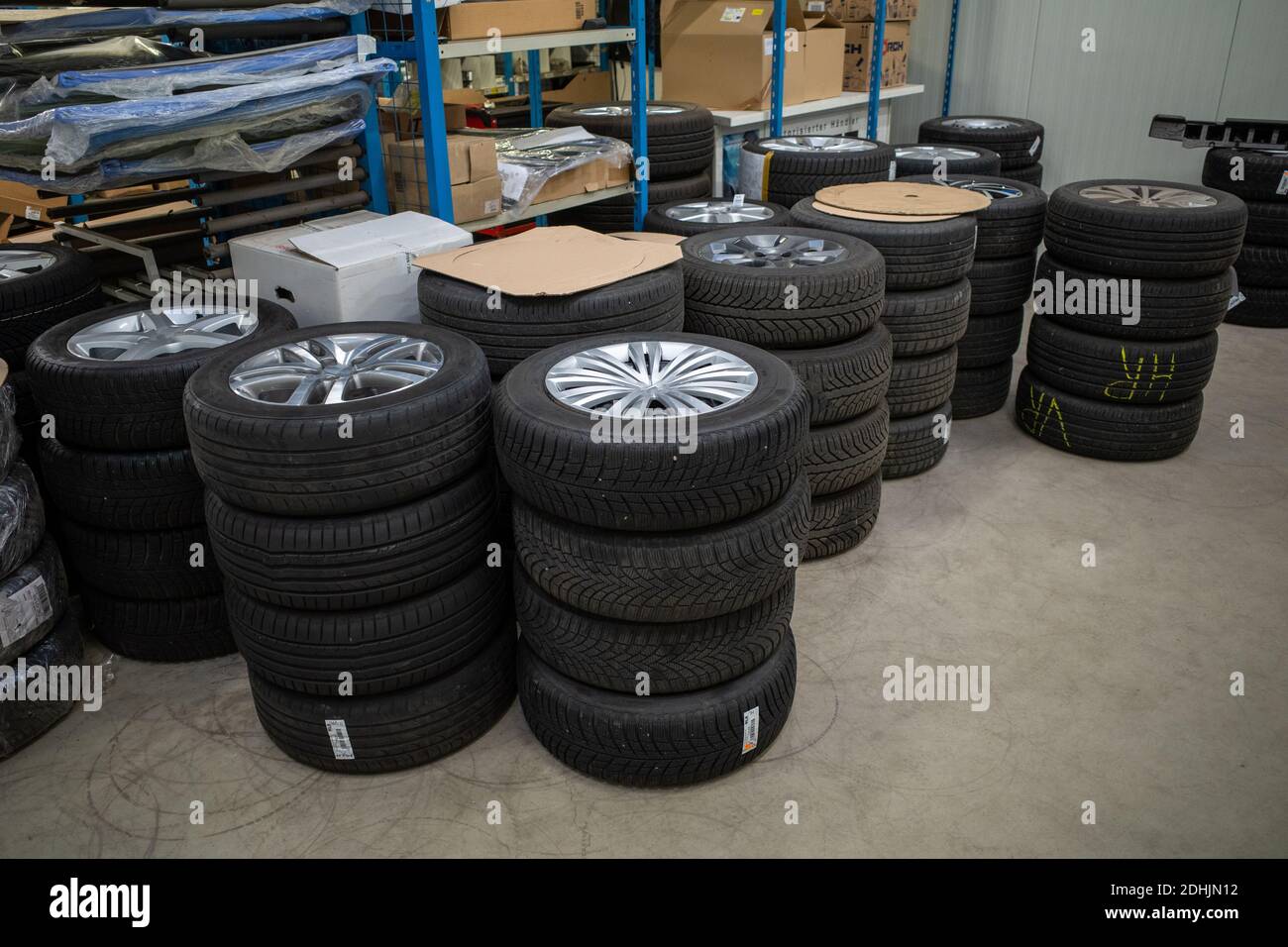 in a car workshop there are many stacked car tires Stock Photo - Alamy