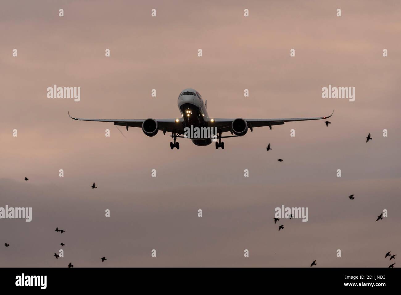 Early morning arrival. Jet airliner plane on approach to land at London ...