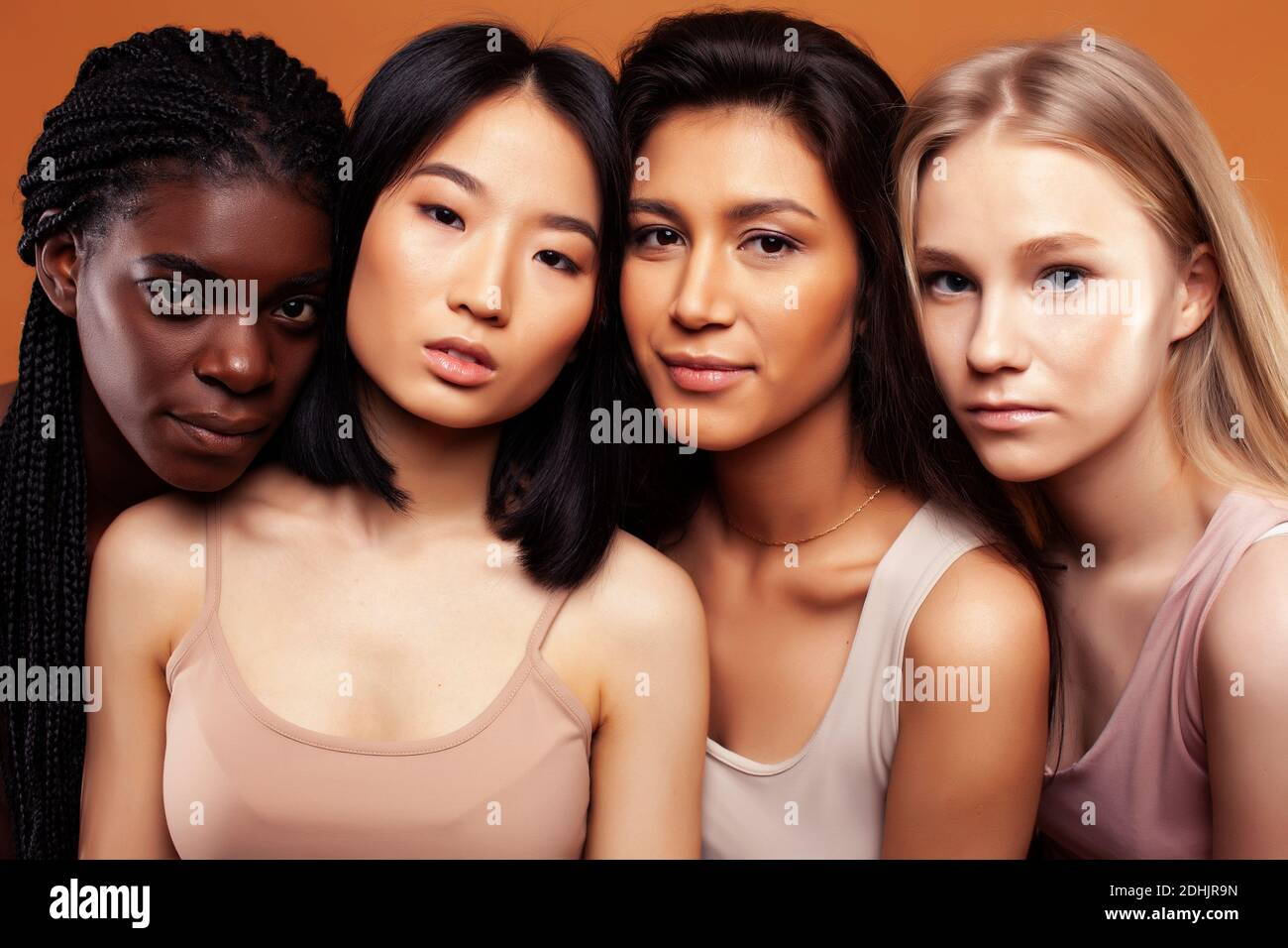 young pretty asian, caucasian, afro woman posing cheerful together on ...