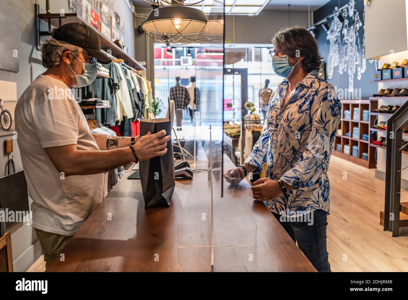 Cashier customer cloth store male hi-res stock photography and images ...