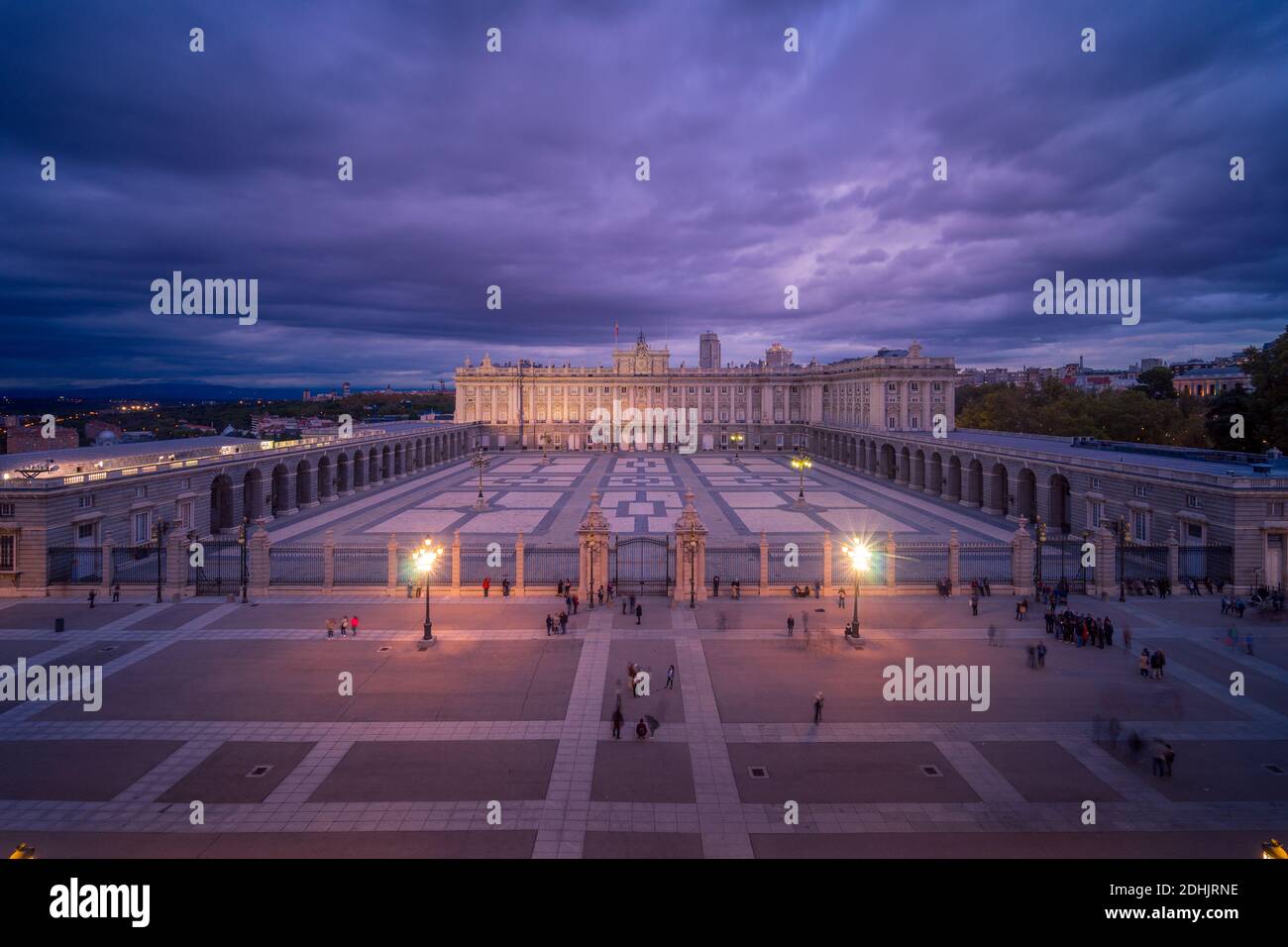 Magnificent scenery of Royal Palace of Madrid and square illuminated by ...