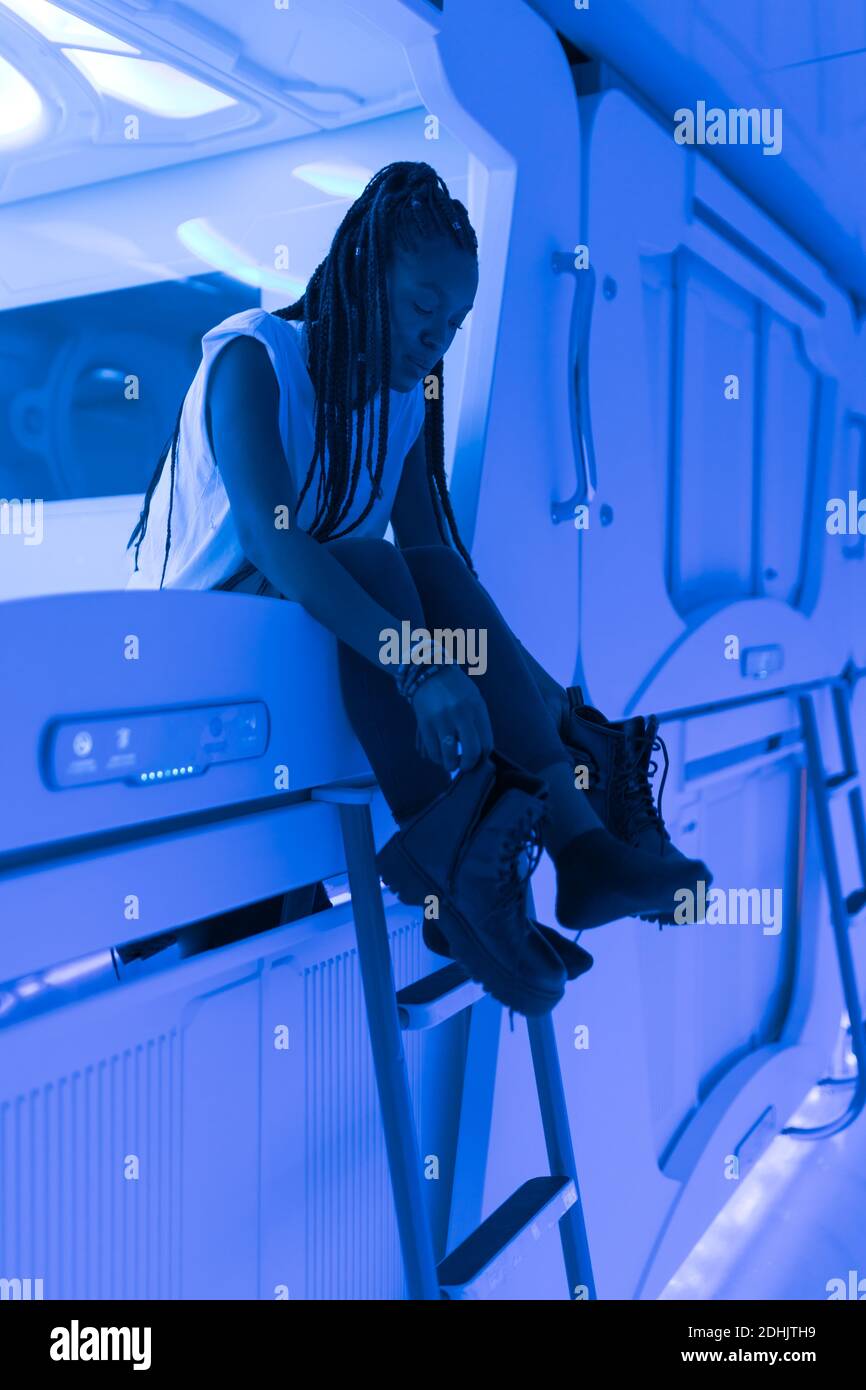 Woman taking off her boots hi-res stock photography and images - Alamy