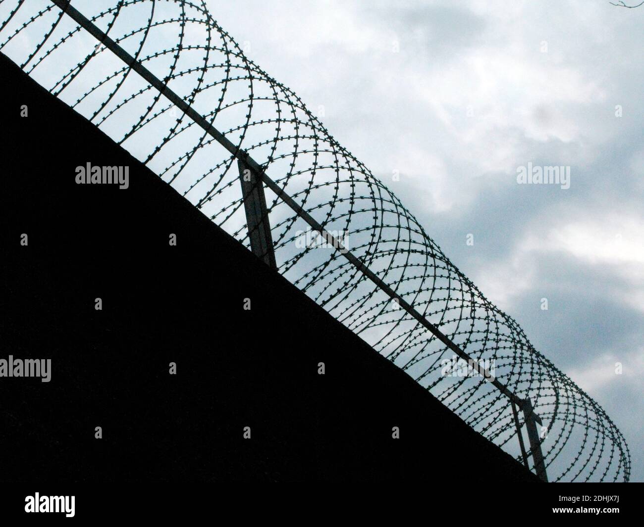 barbed wire as barrier in a prison, measure to prevent outbreaks Stock ...