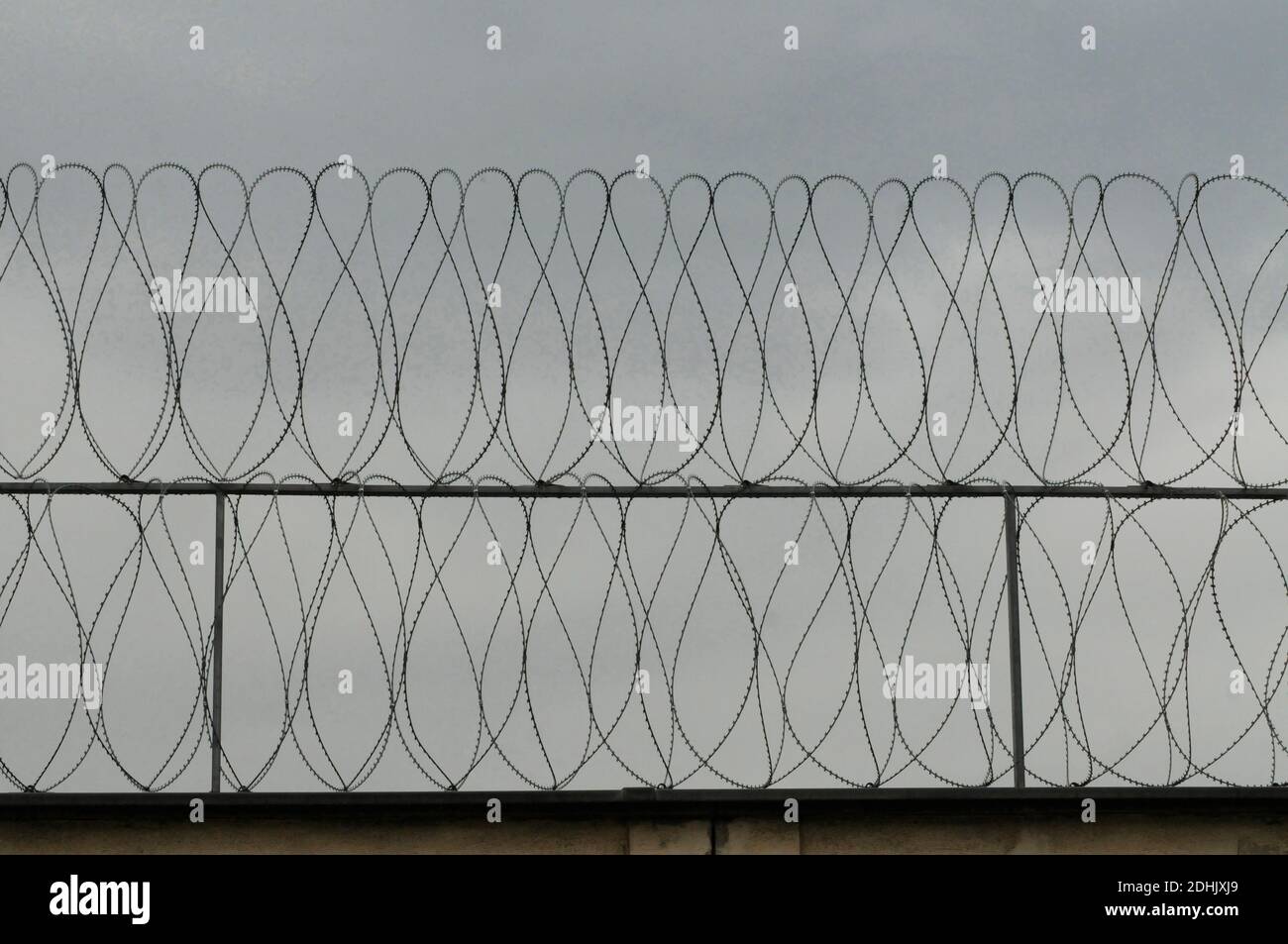 barbed wire as barrier in a prison, measure to prevent outbreaks Stock ...
