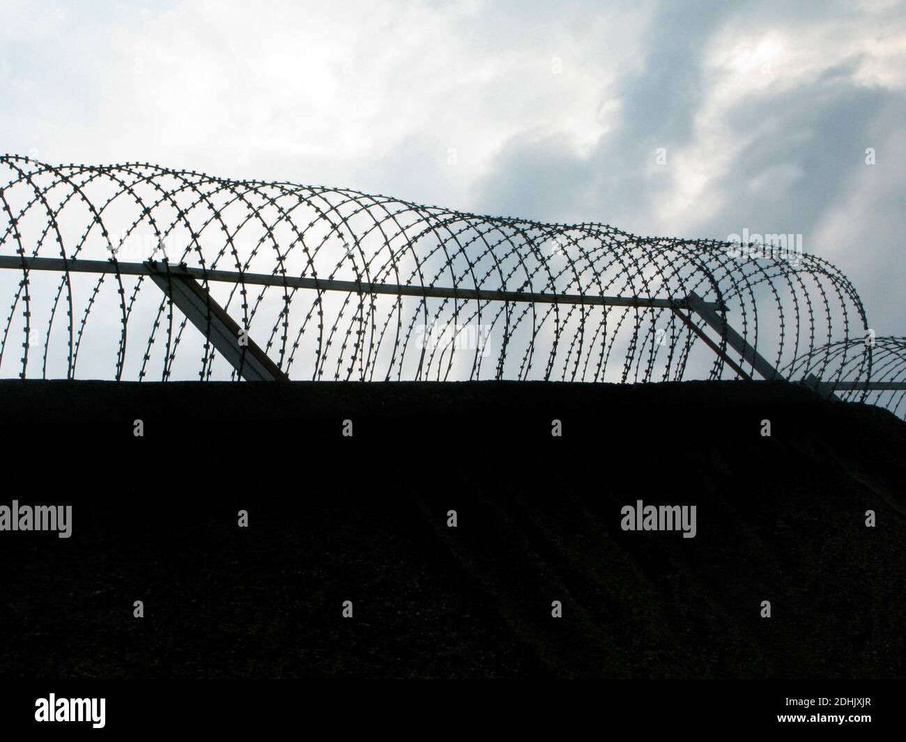 barbed wire as barrier in a prison, measure to prevent outbreaks Stock ...