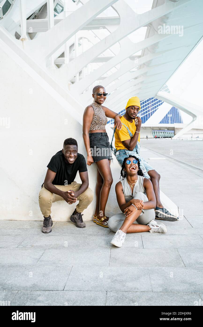 Stylish African American friendly people gathering in modern urban area ...