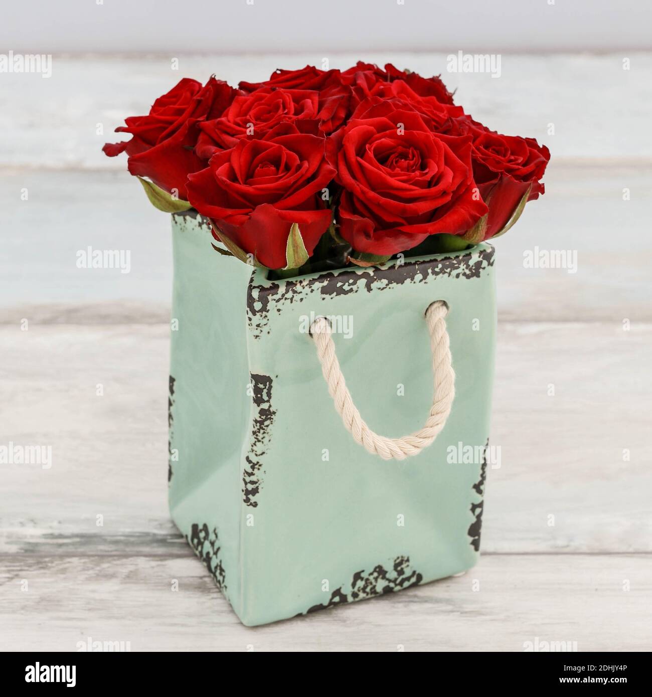 Flower box with red roses. Party decor Stock Photo - Alamy