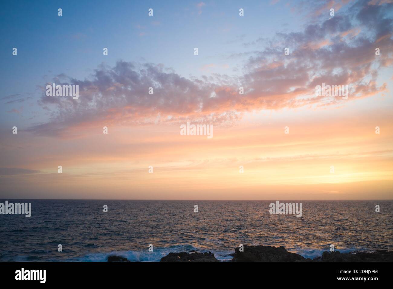 Amazing peaceful scenery of colorful sunset sky with clouds above calm ...