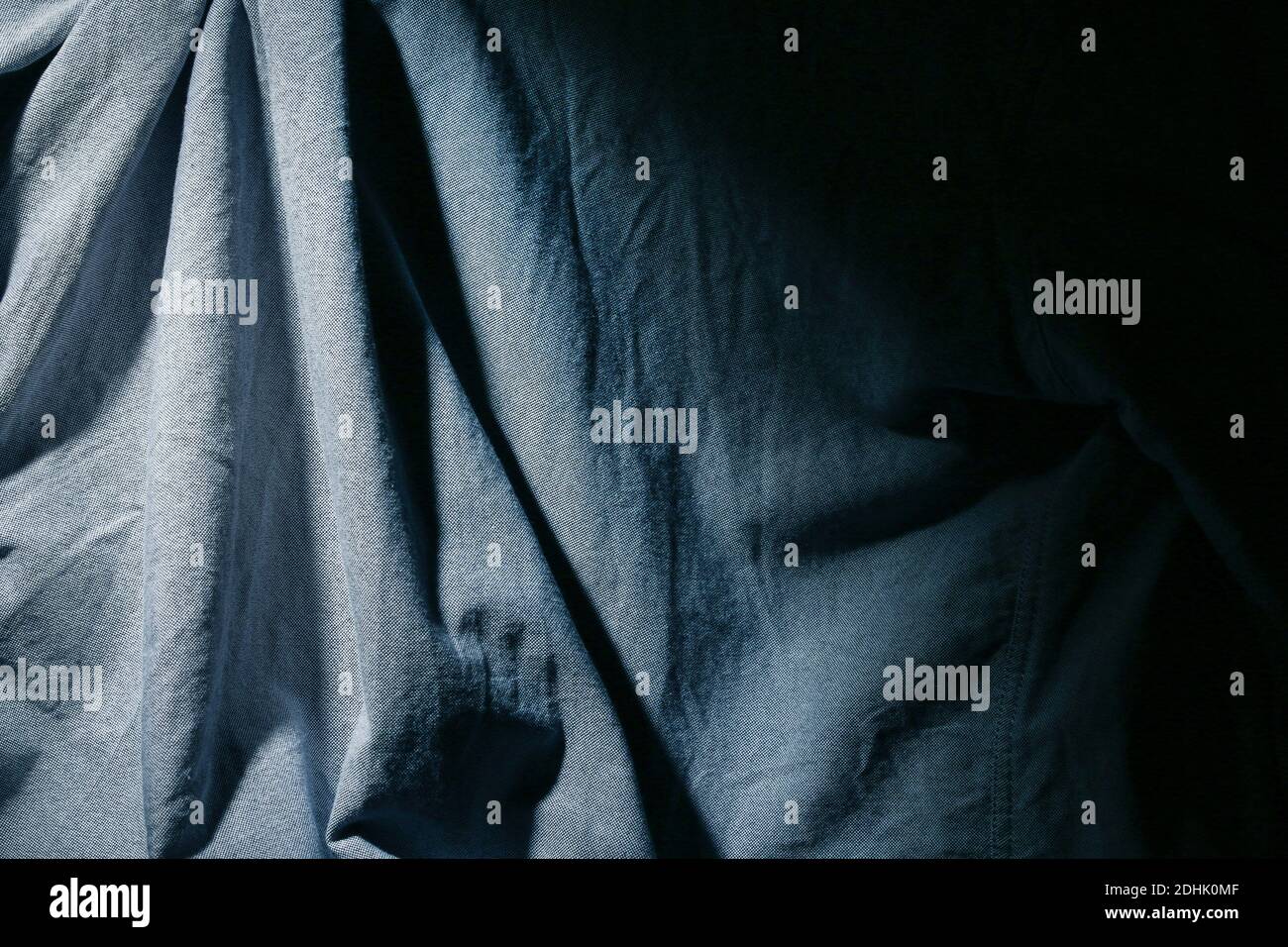 Dramatic lighting on denim fabric. Background, wallpaper Stock Photo ...