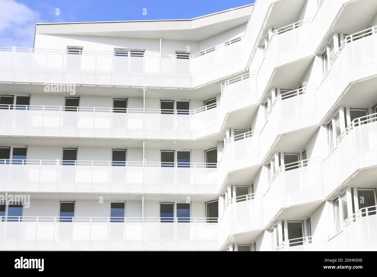 Modern all white apartment building Stock Photo - Alamy