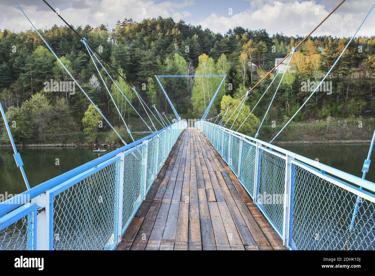 Wooden bridge over deep river. Summer time Stock Photo - Alamy