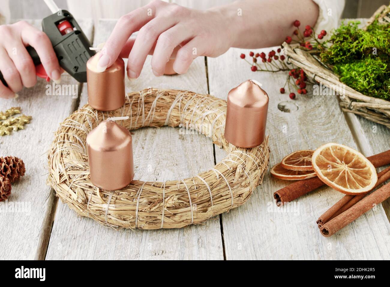 Florist at work: How to make advent table wreath, step by step Stock Photo - Alamy