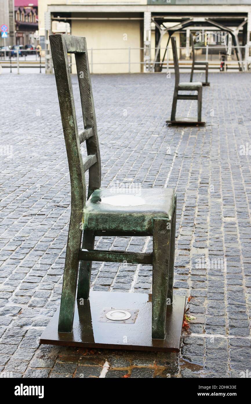 Chairs monument at the cobbled square in Krakow, Poland Stock Photo - Alamy