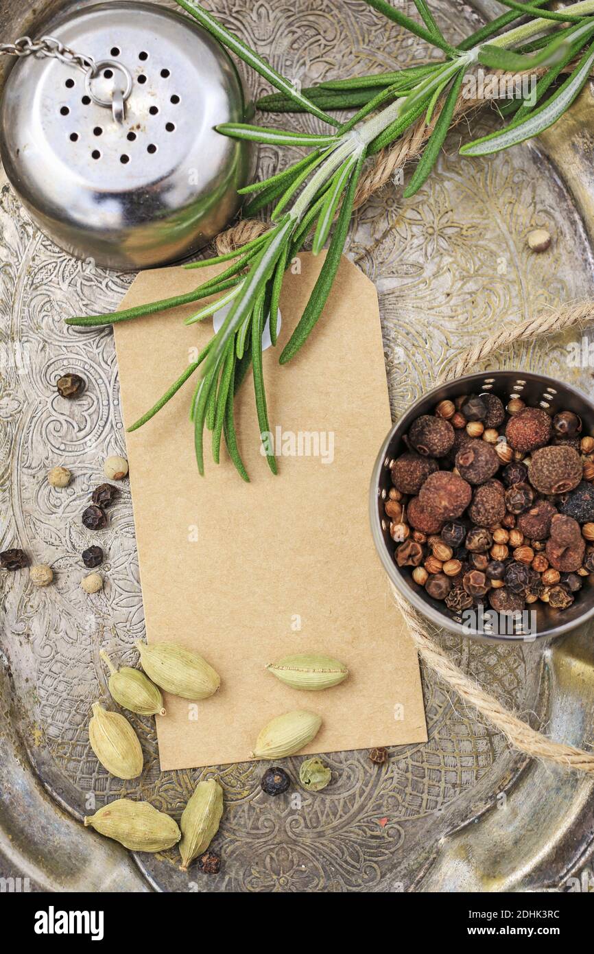 Rosemary (Rosmarinus officinalis) twig and vintage paper card lying on ...