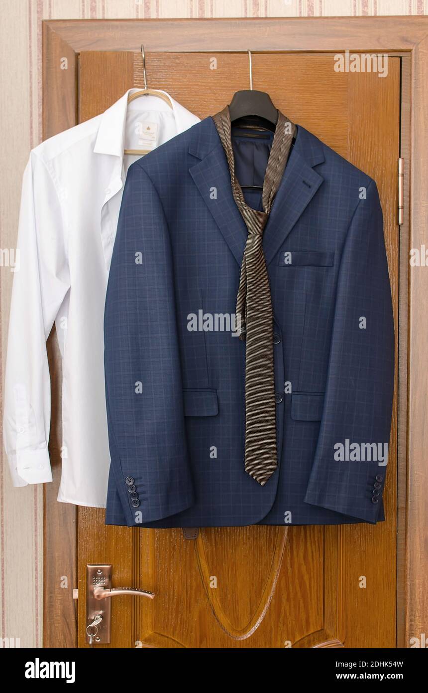 Hanging groom suit hi-res stock photography and images - Alamy
