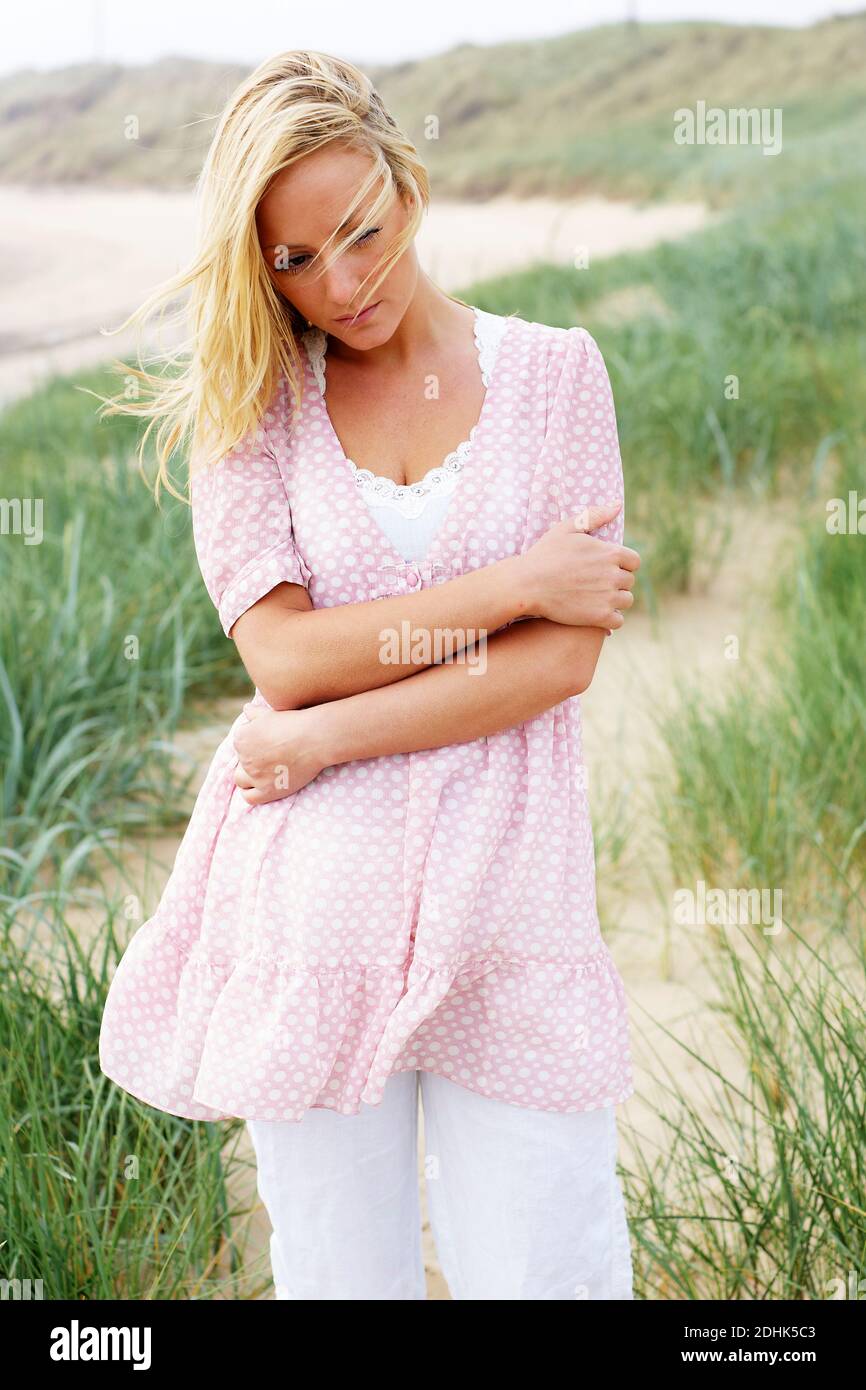 Thoughtful woman outdoors Stock Photo - Alamy