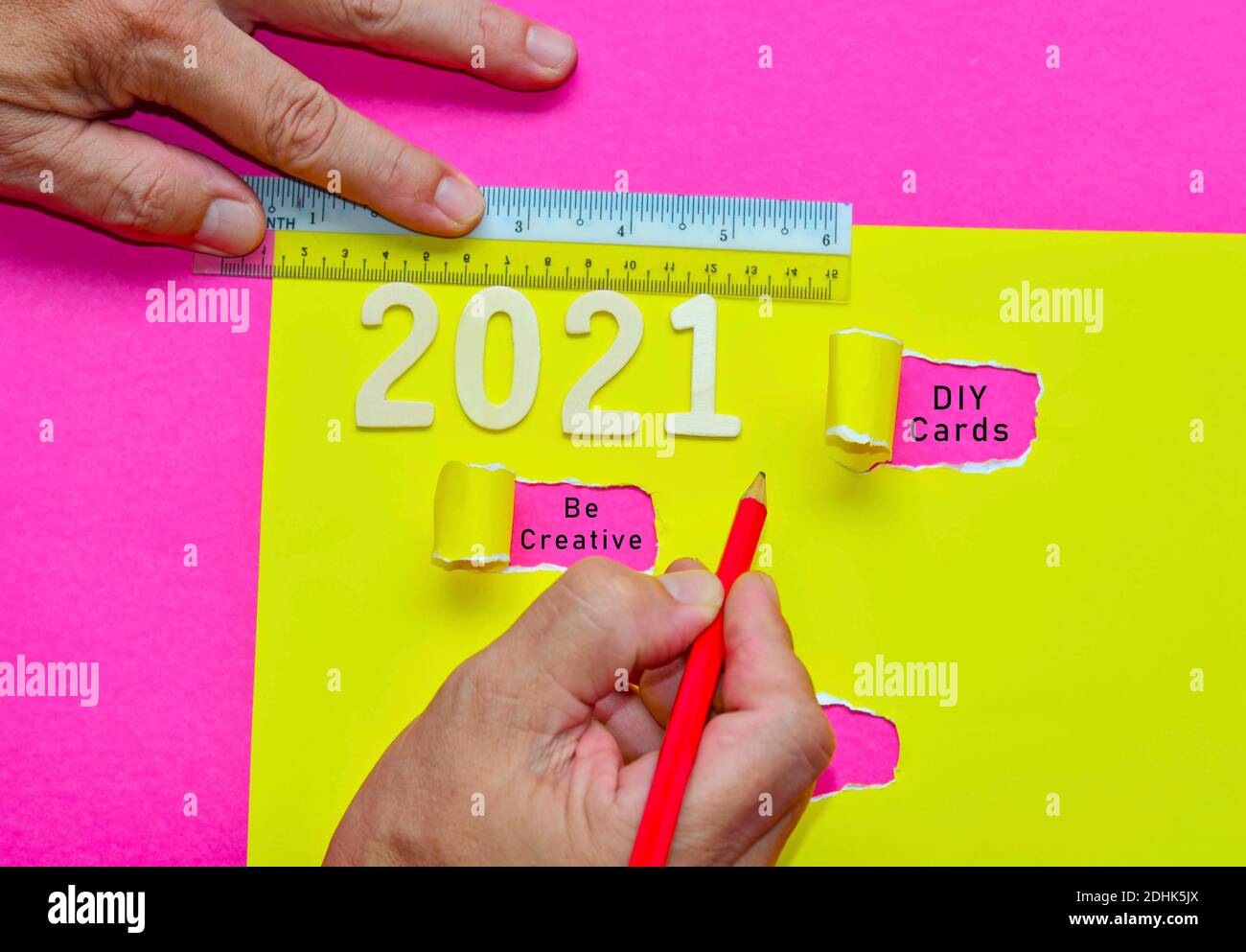 Close up view of a hand holding pencil and ruler design own greeting ...